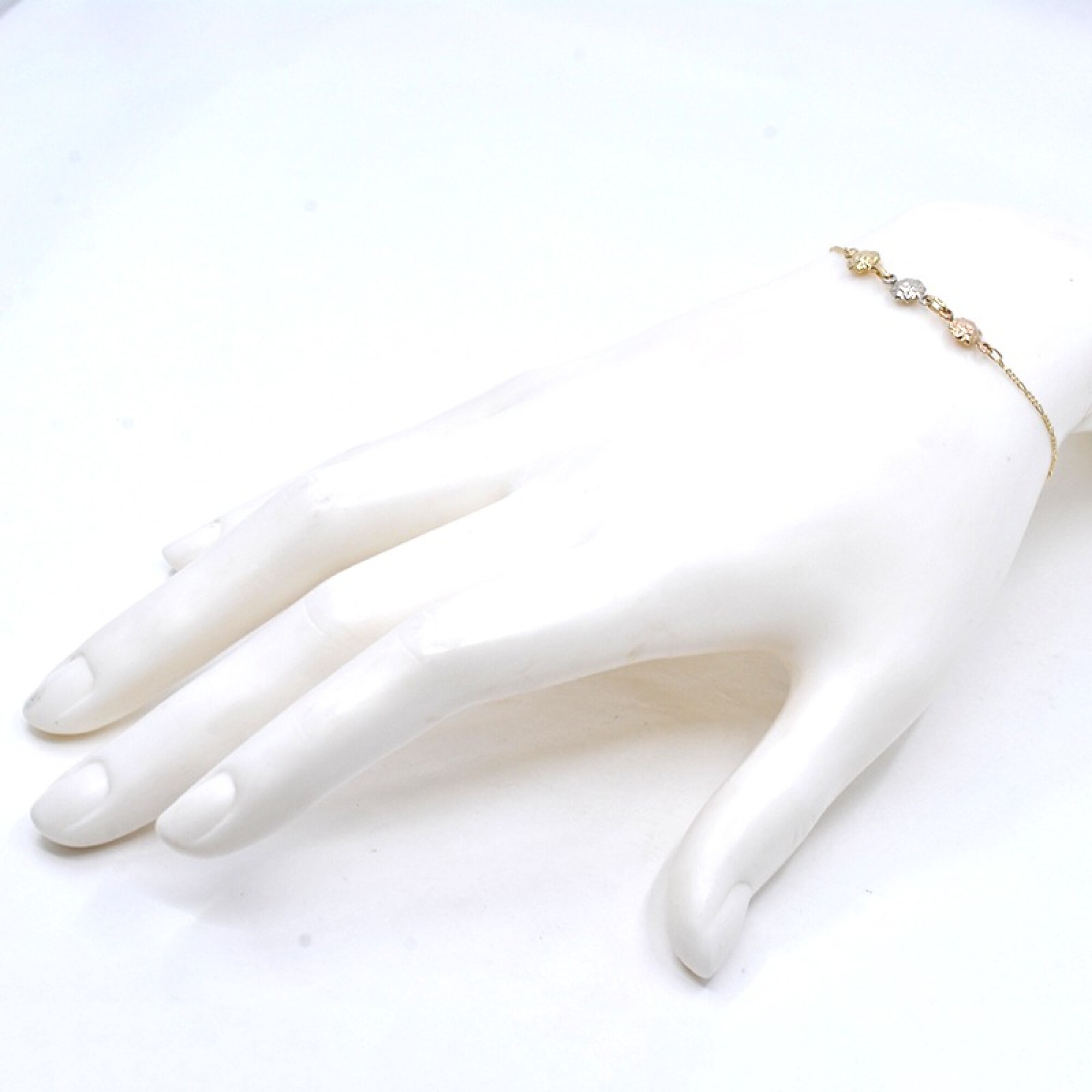 Pulsera fina en oro 18k de 2 tonos con 3 soles — Facello Joyeros