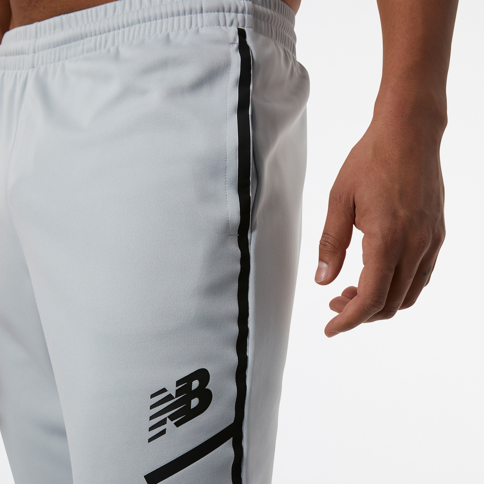 Pantalon New Balance de hombre - TENACITY - MP23091LAN - BEIGE — New ...